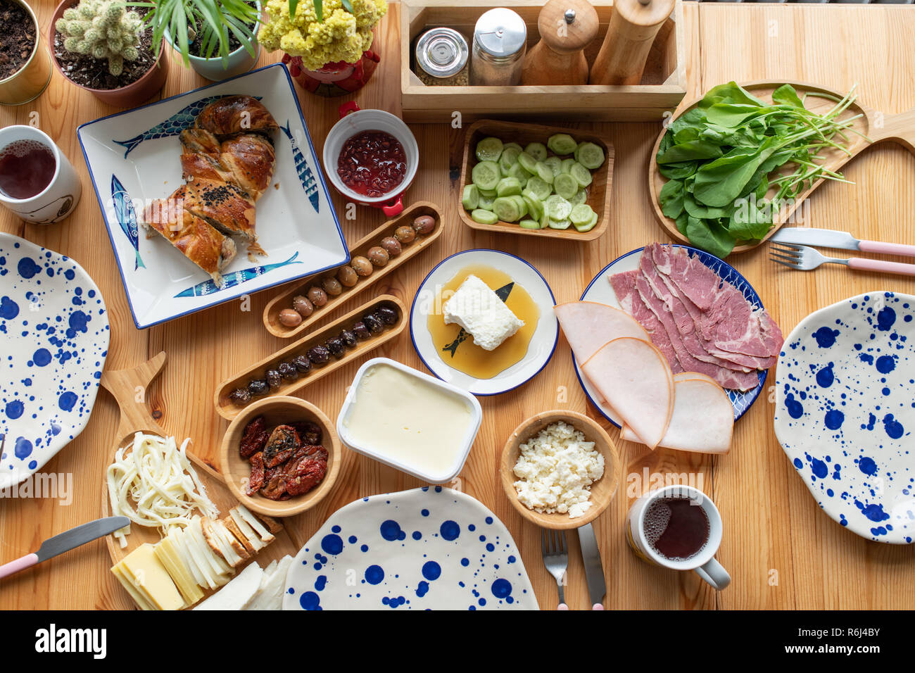 Traditional Turkish Breakfast, eggs with sucuk, bal kaymak, olives, ham ...