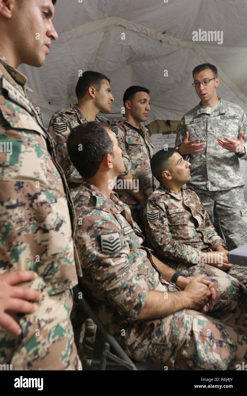 U.S. Army Sgt. Erik Jones, far right, a psychological operations ...