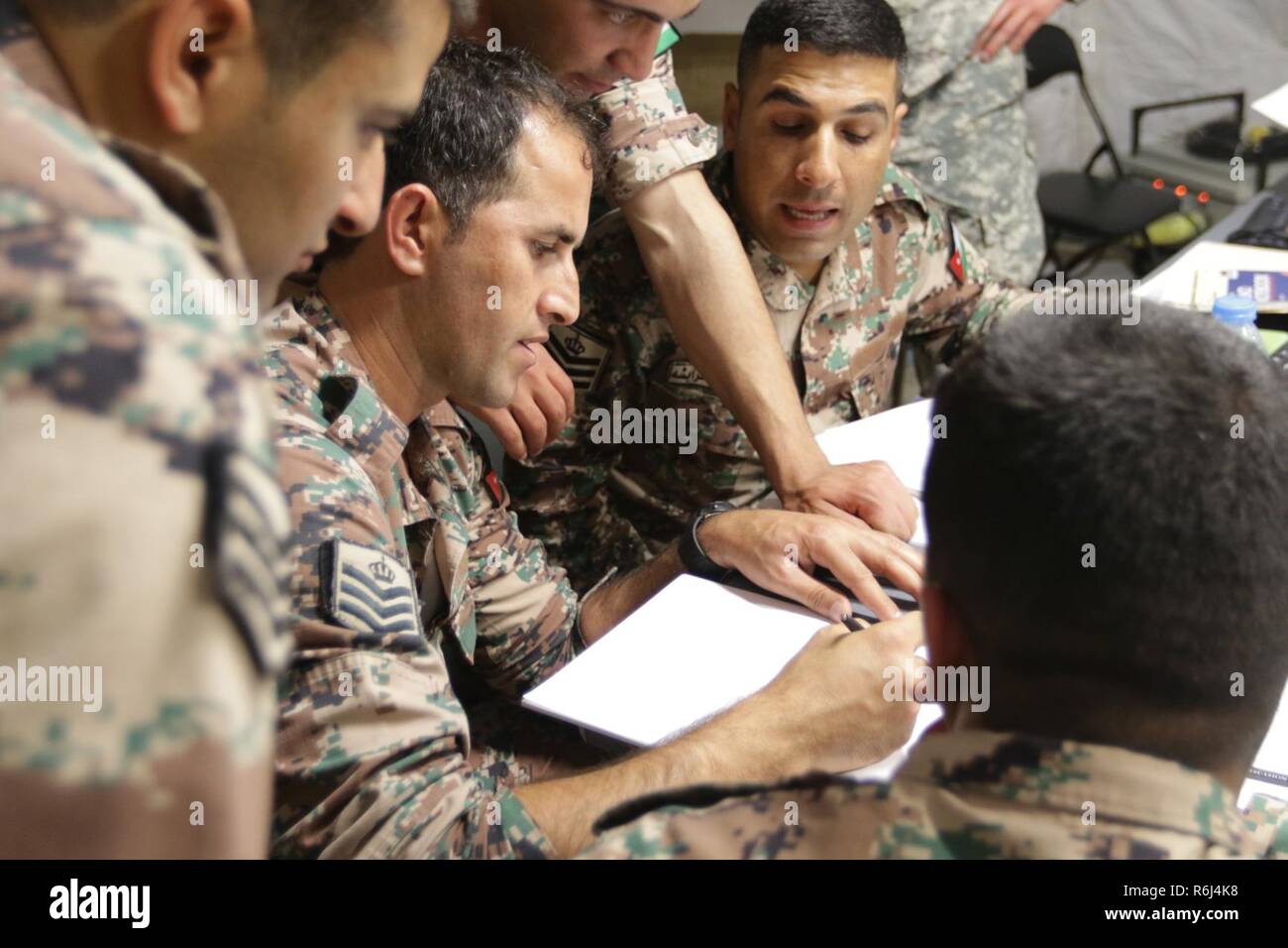U.S. Army Sgt. Erik Jones, second from left, a psychological operations ...