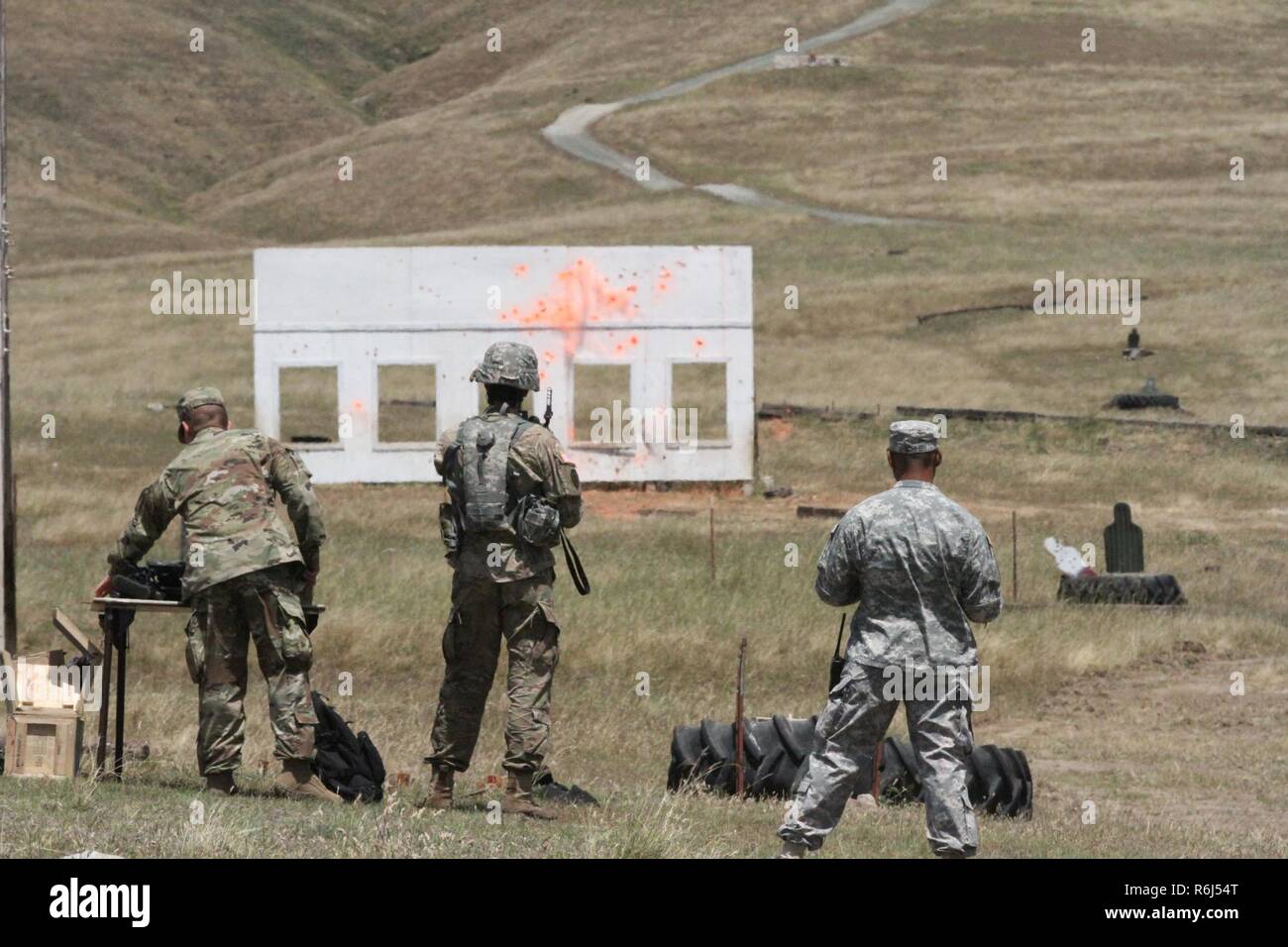 California Army National Guardsman Sgt. James Peterson fires a grenade ...