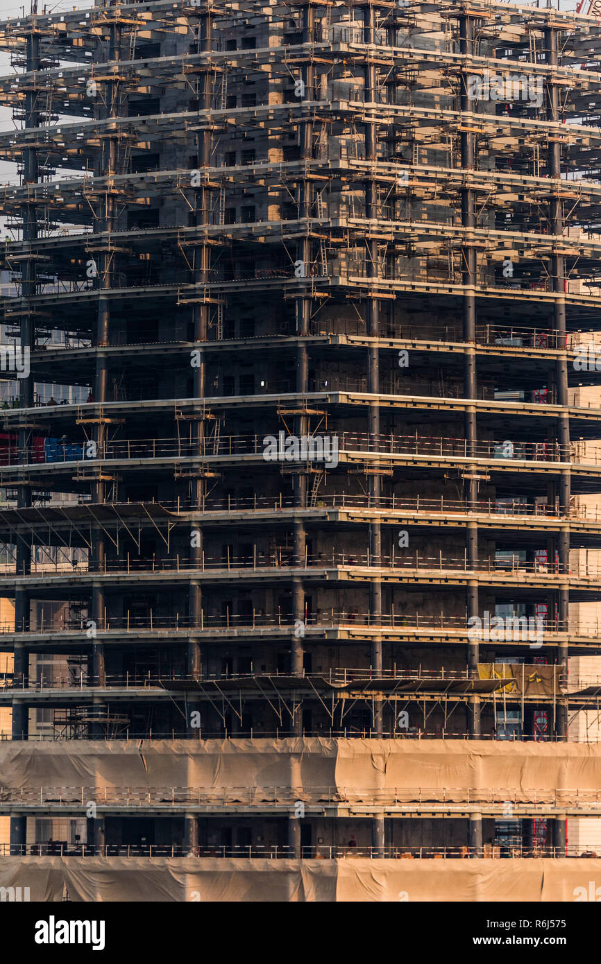 Dubai, UAE - October, 2018 Building construction of new skyscrapers ...