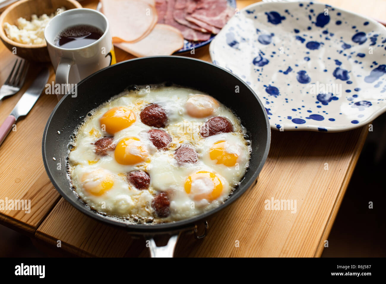 Traditional Turkish Breakfast, eggs with sucuk, bal kaymak, olives, ham ...