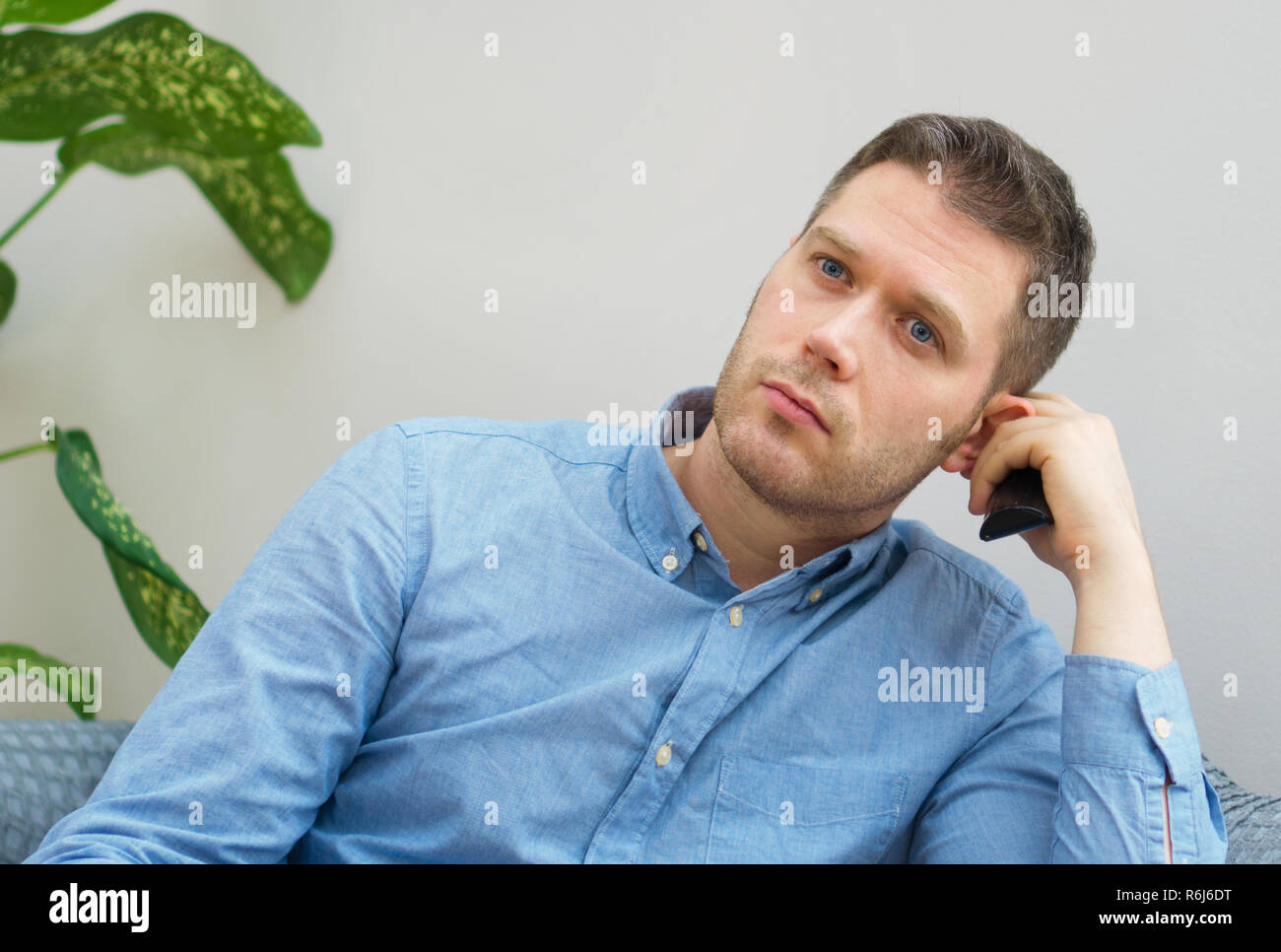 Bearded man watching tv hi-res stock photography and images - Alamy