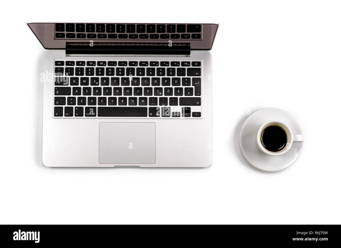 Top view of modern retina laptop with cup of coffee, isolated on white ...