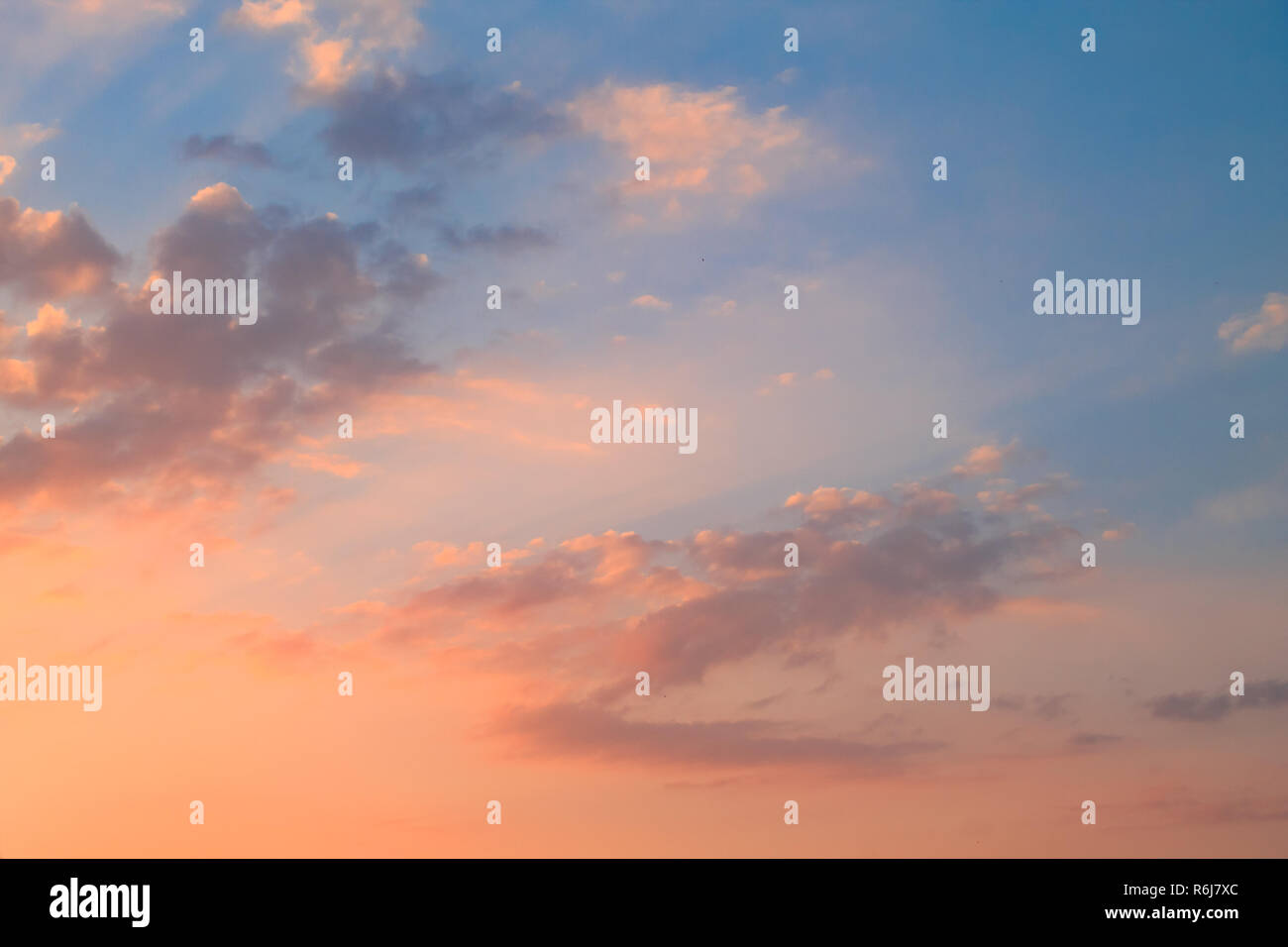 The rad clouds during sunset and blue sky background Stock Photo - Alamy