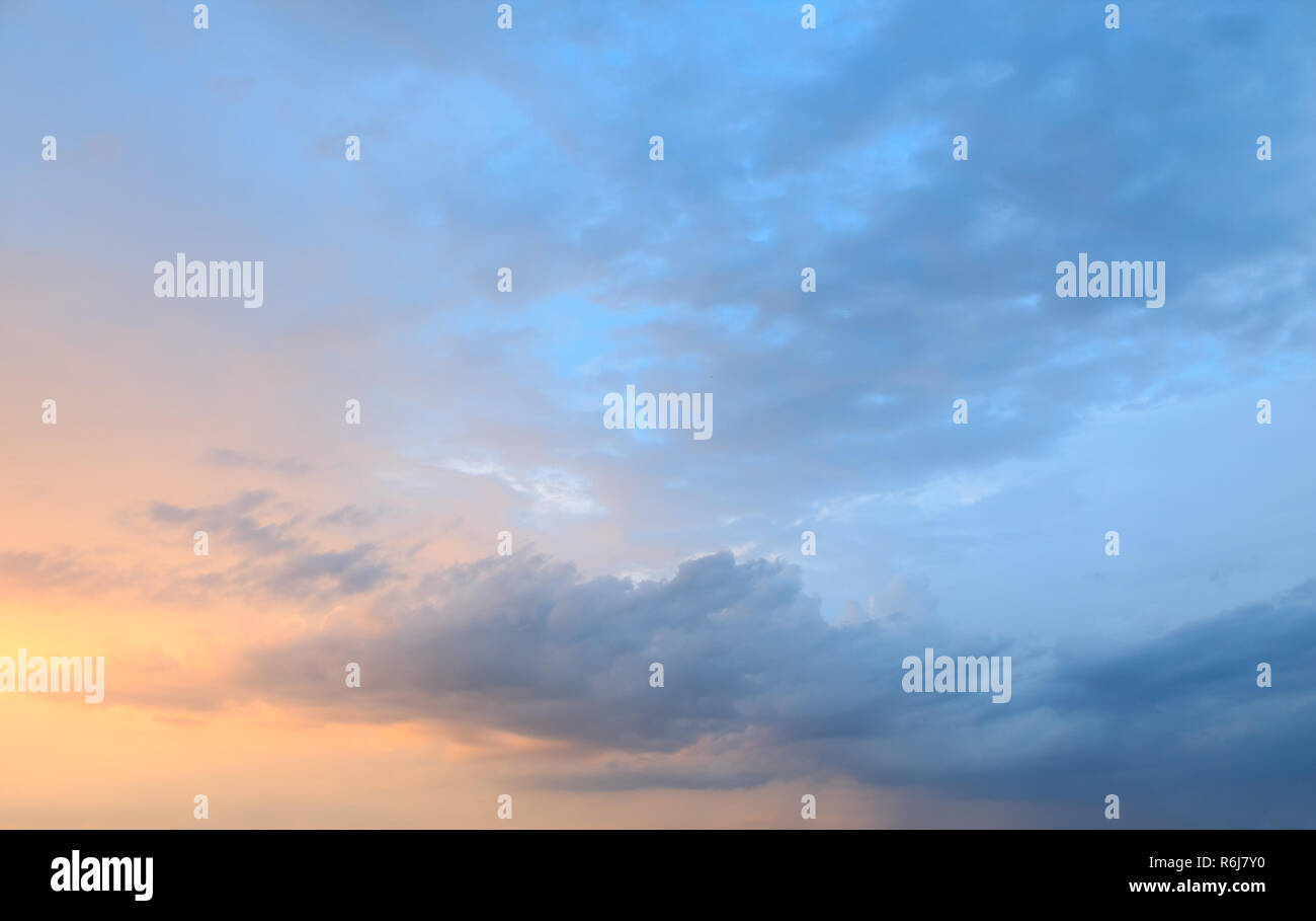 purple dramatic sunset and blue sky background Stock Photo - Alamy