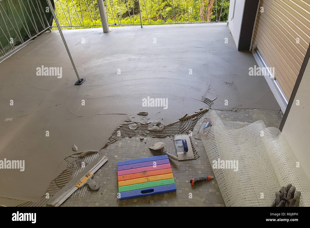 Balcony floor tiles installation. Laying tiles from porcelain. Interior ...