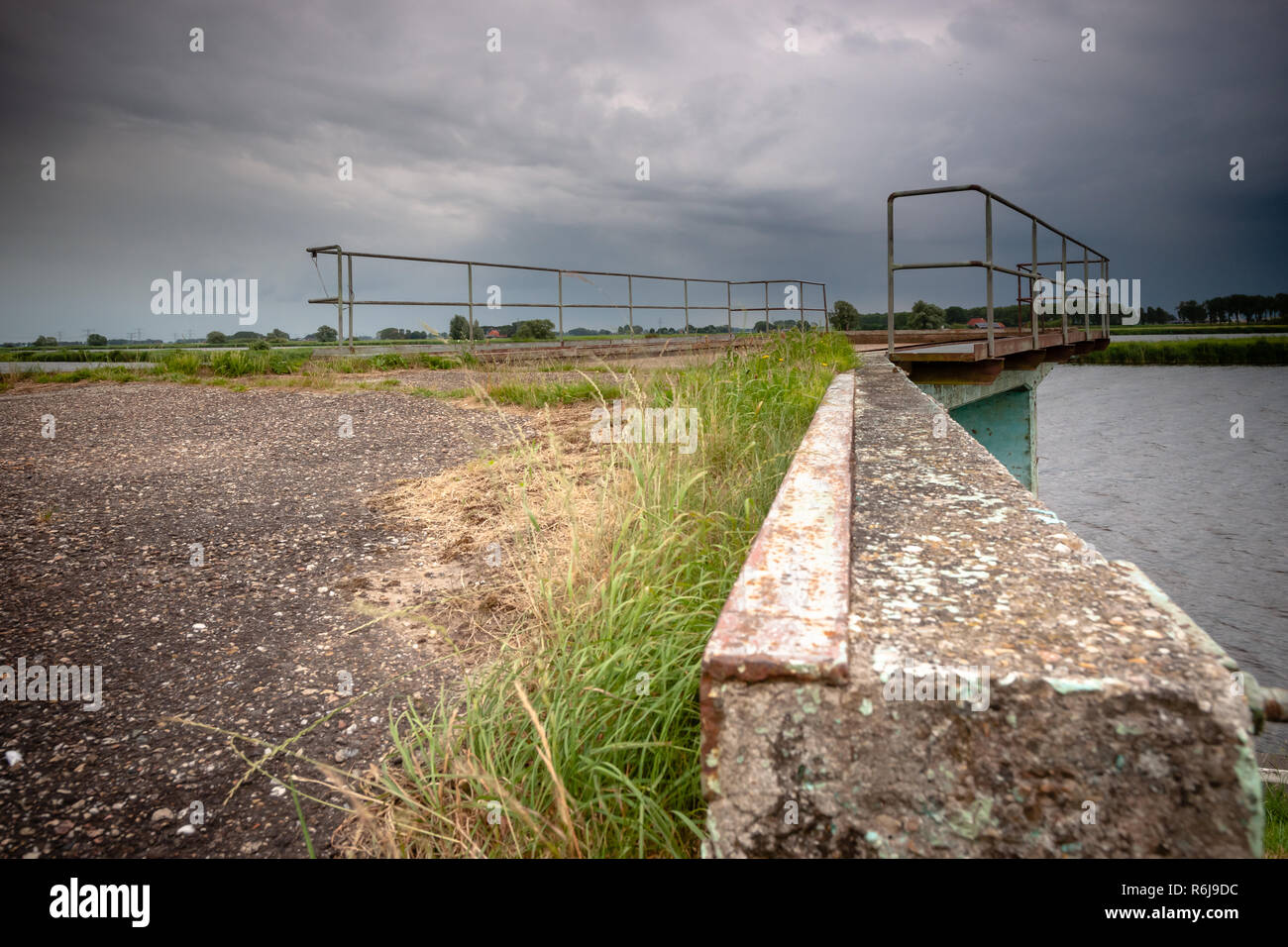 Old and dilapidated vintage rampart along the waterfront in a river ...
