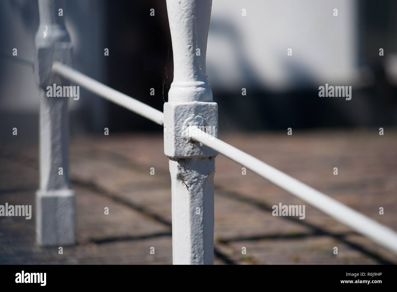 White painted decorative wrought iron railing. Romantic atmosphere ...