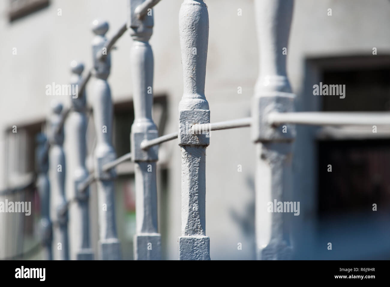 White painted decorative wrought iron railing. Romantic atmosphere ...
