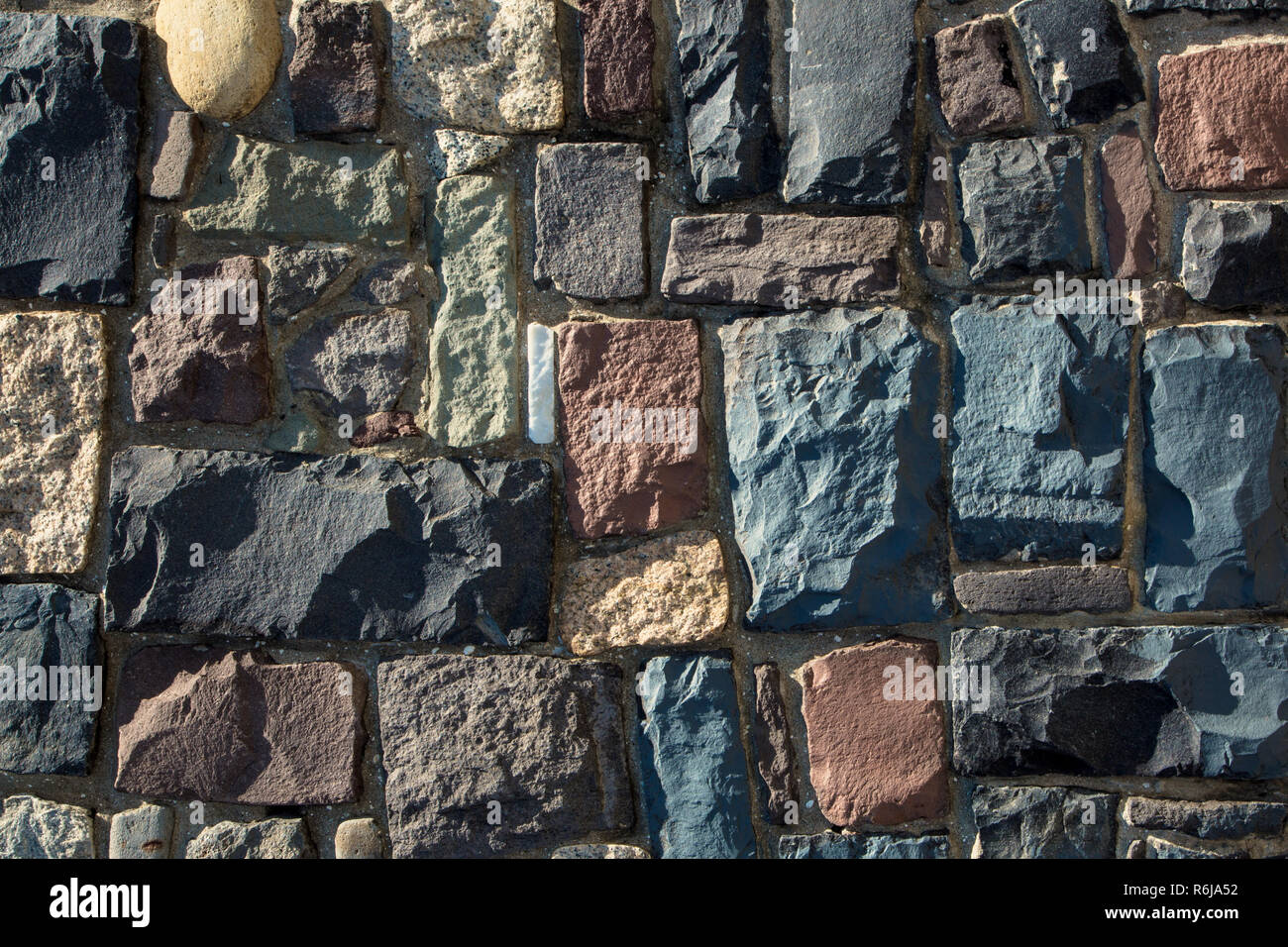 Colored cobblestone wall texture Stock Photo - Alamy