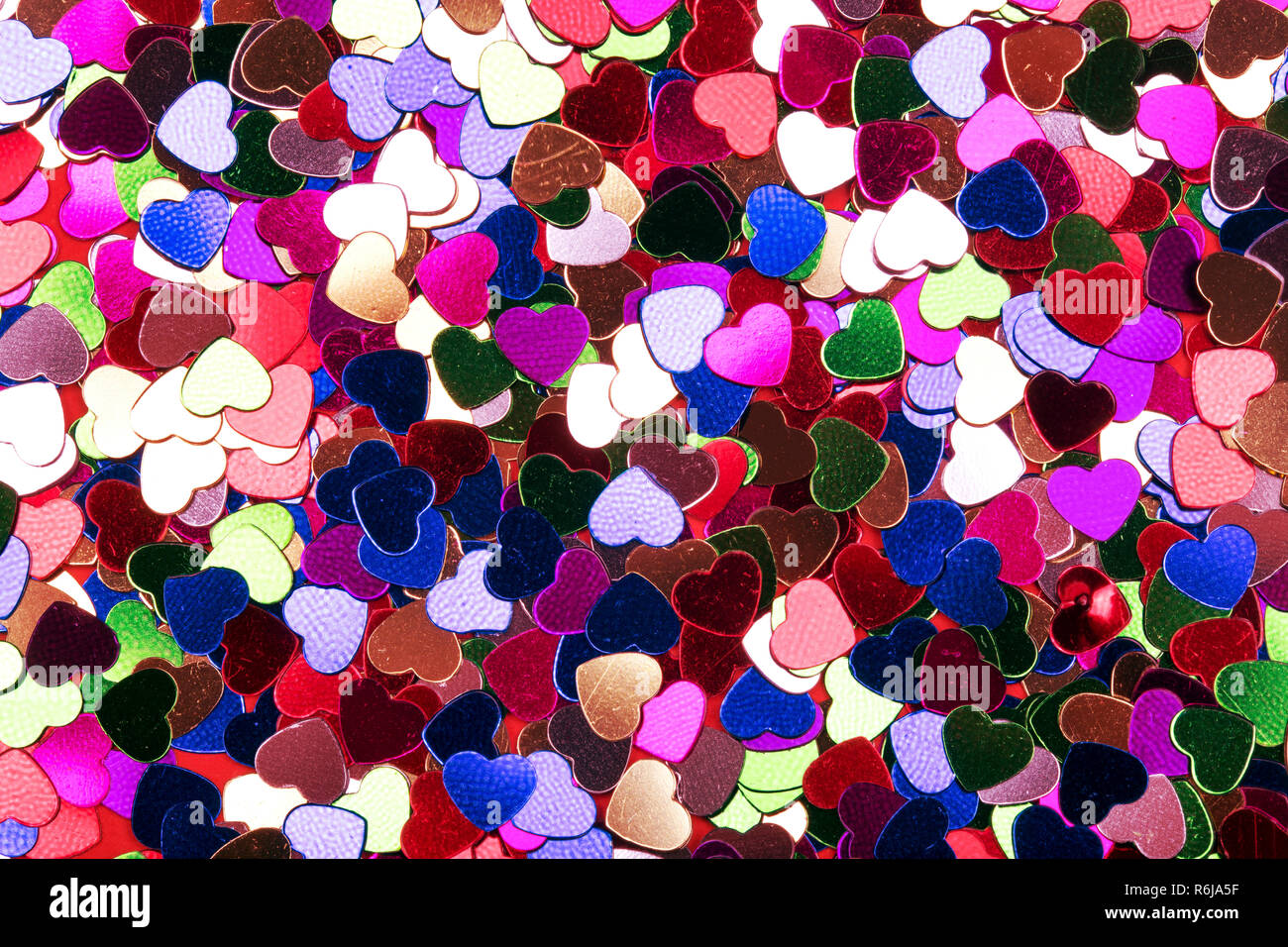 many small decorative hearts of different colors, background image ...