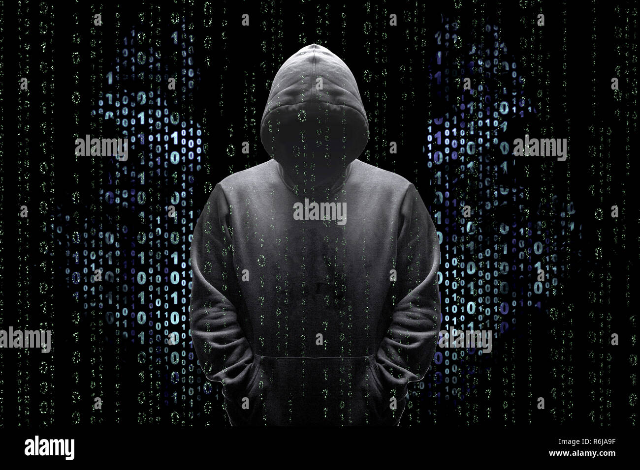 binary code on the background of the silhouette of a hacker in the hood ...
