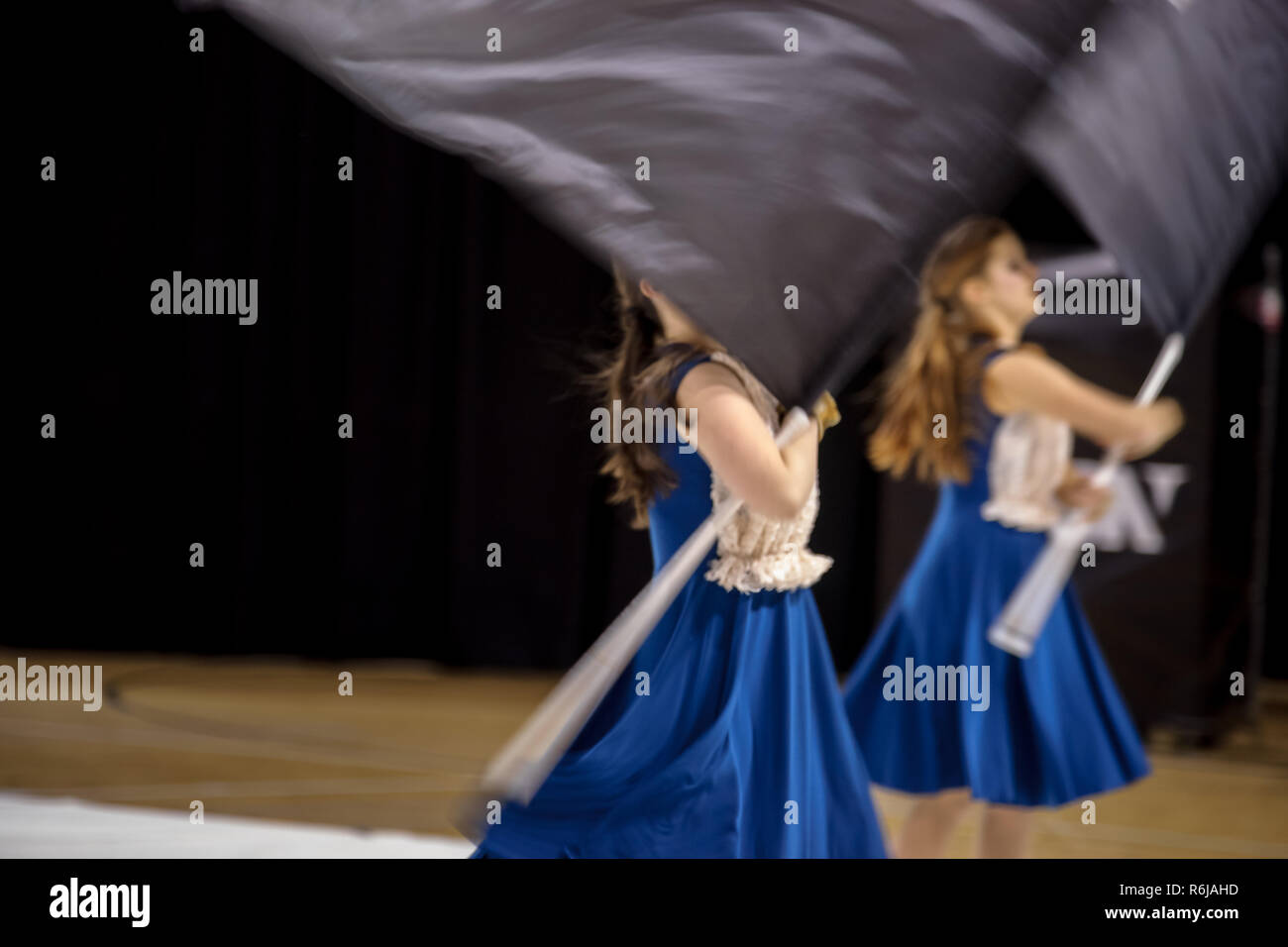 Color guard of a drum & bugle corps during an indoor contest with ...