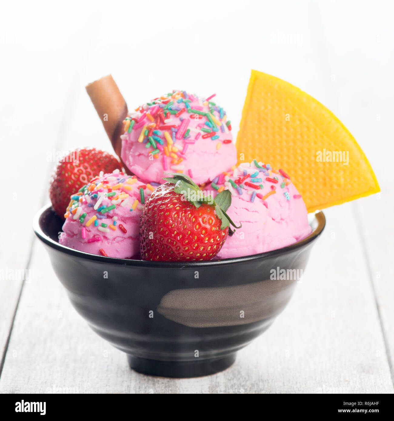Pink ice cream with fruits Stock Photo - Alamy
