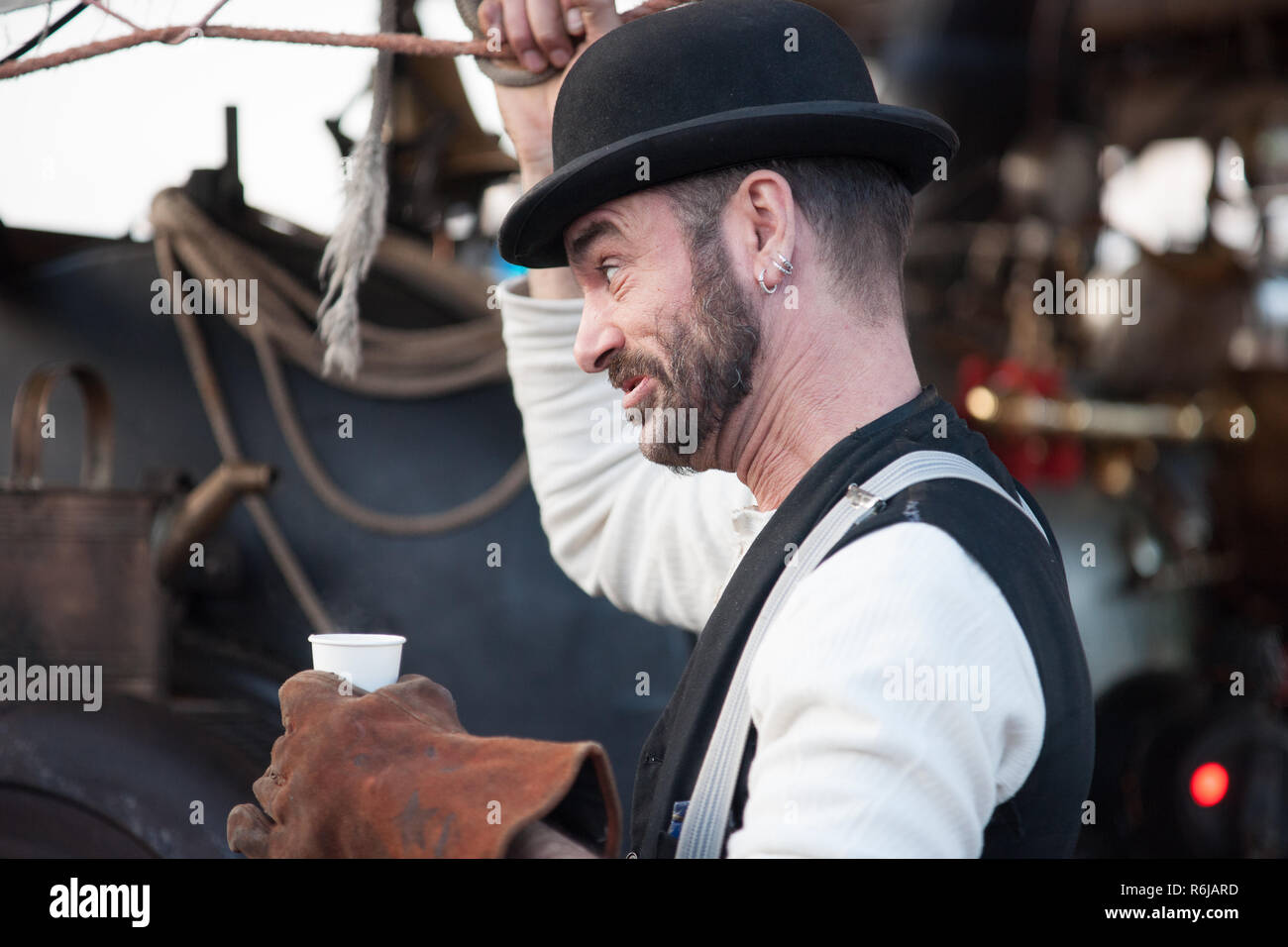 Vintage barista prepare coffee to customer in old style machine with ...
