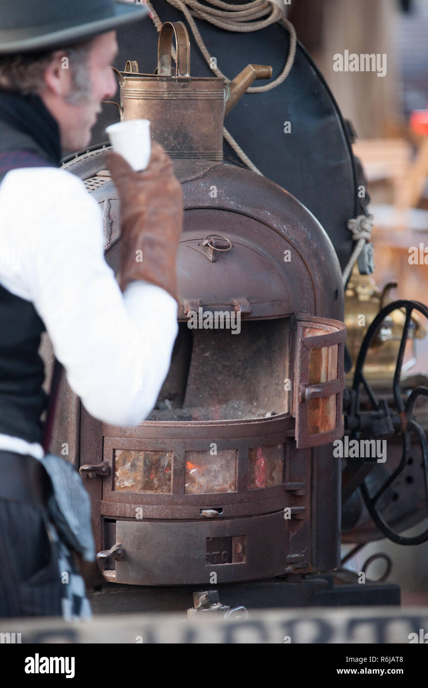 Vintage barista prepare coffee to customer in old style machine with ...
