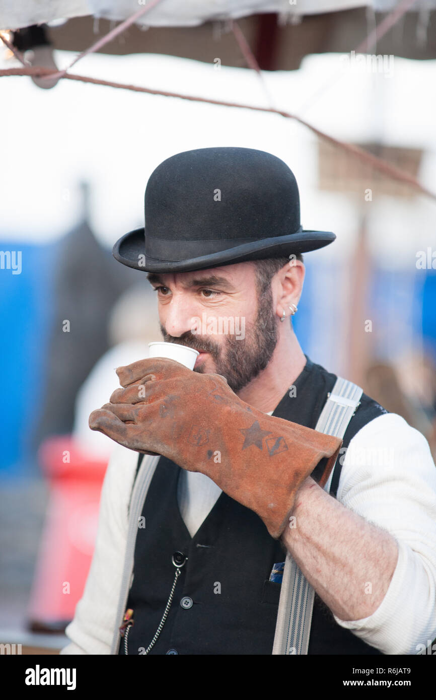 Vintage barista prepare coffee to customer in old style machine with ...