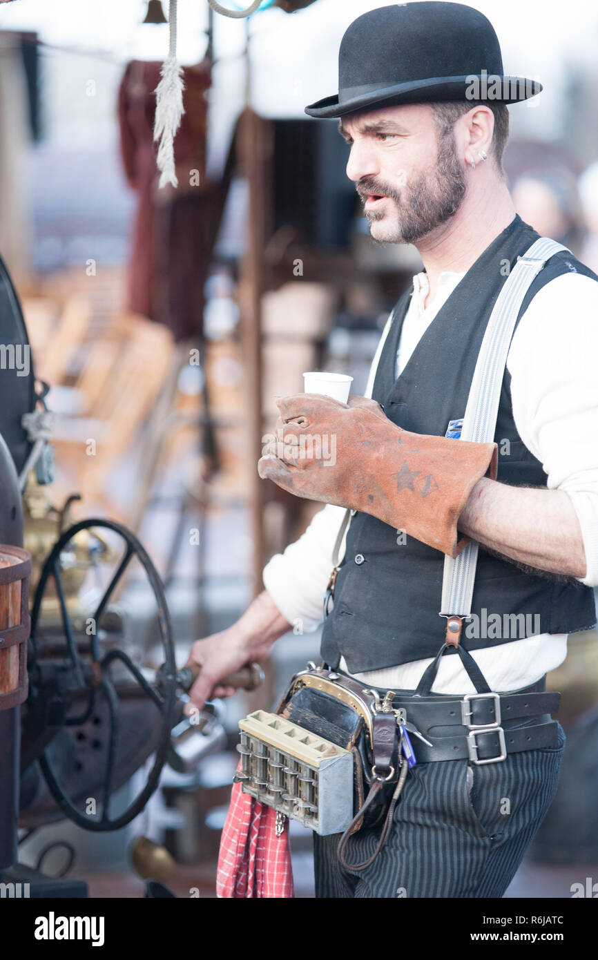 Vintage barista prepare coffee to customer in old style machine with ...