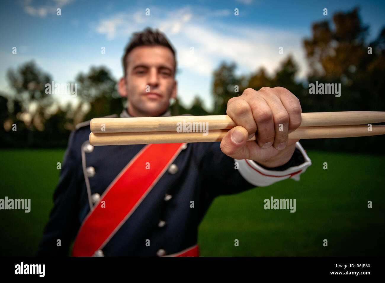 Percussion player or drummer during an outdoor photo shoot with studio ...