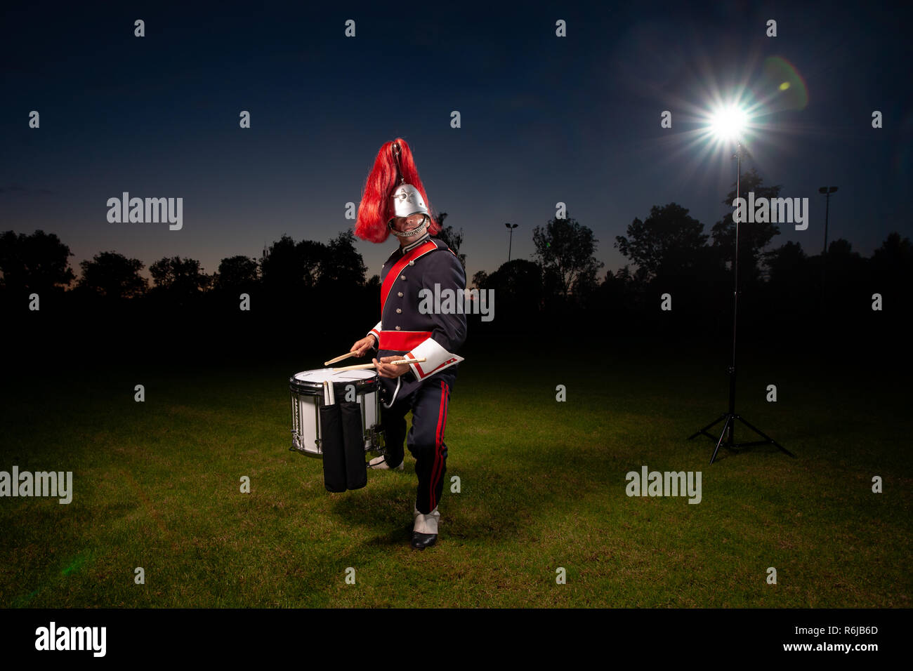 Percussion player or drummer during an outdoor photo shoot with studio ...
