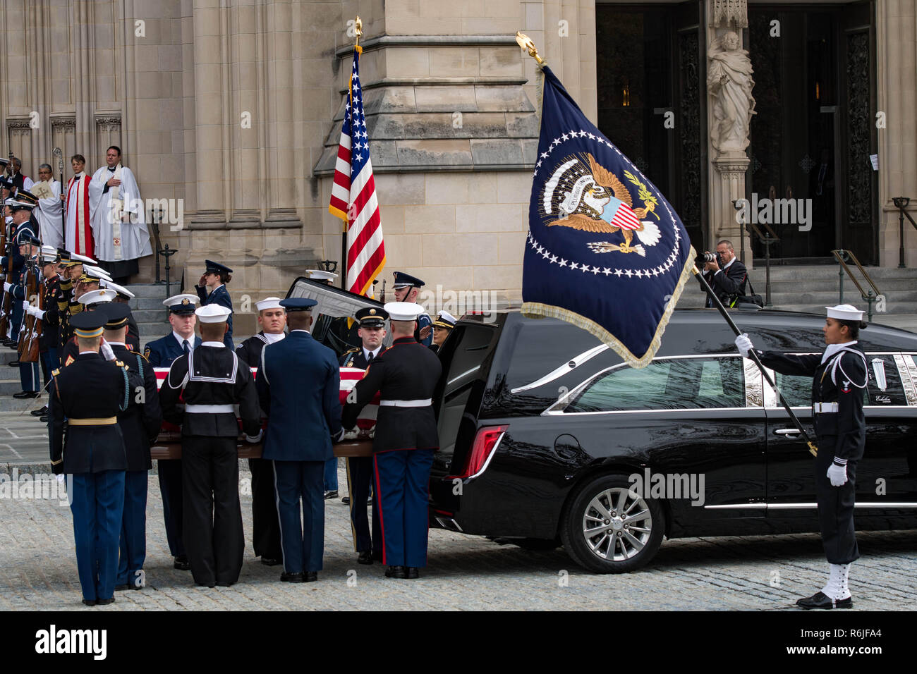 Joint Service pallbearers carry the flag-draped casket of former ...