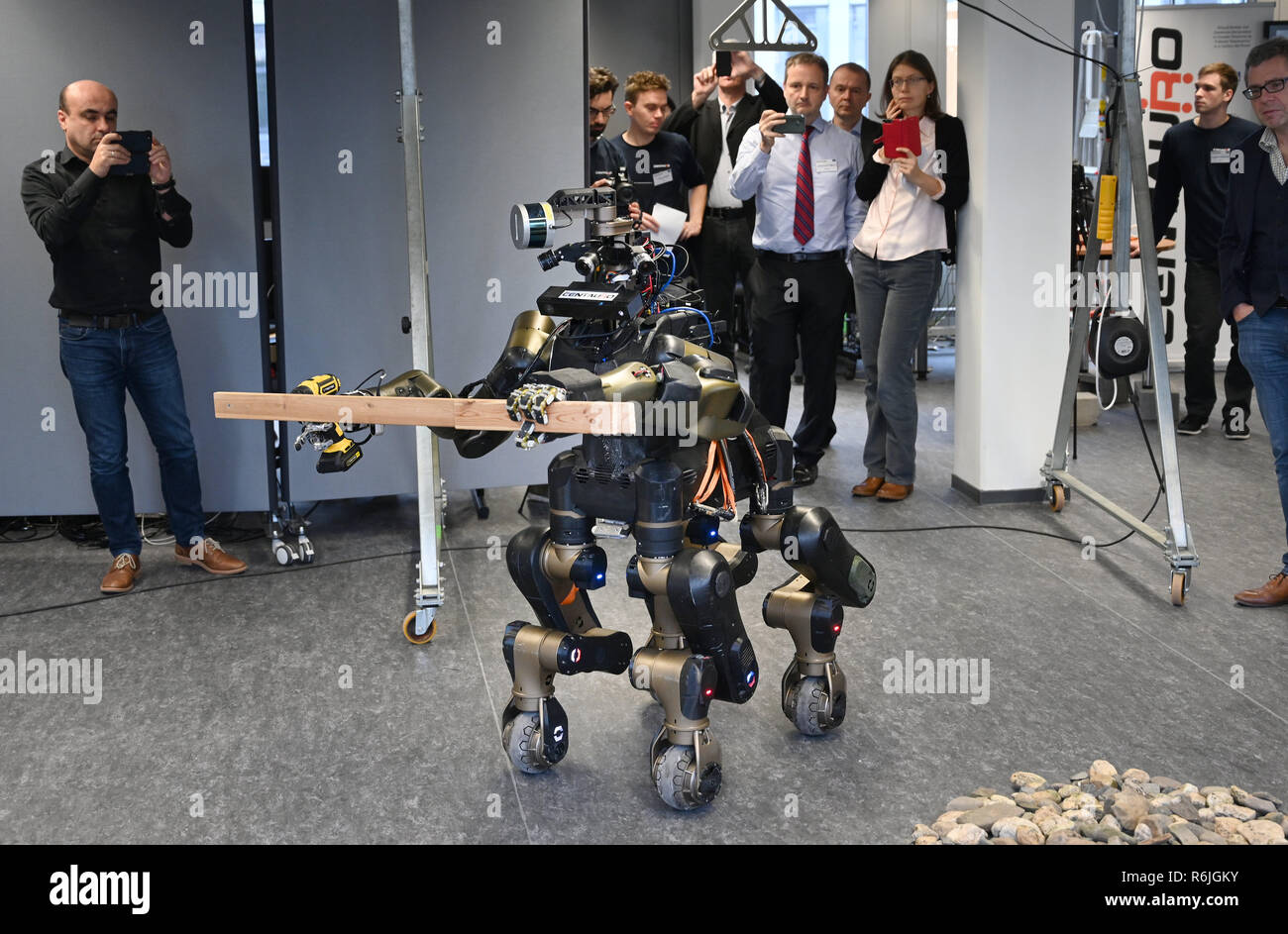 Bonn, Germany. 30th Nov, 2018. The robot "Centauro" carries a wooden ...