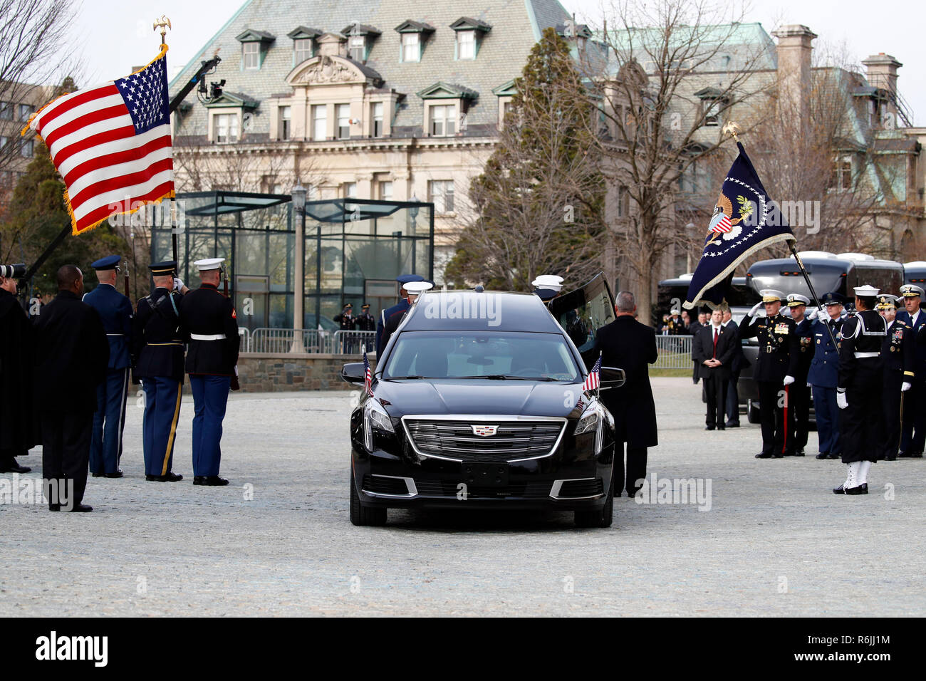 The flag-draped casket of former President George H.W. Bush is carried ...