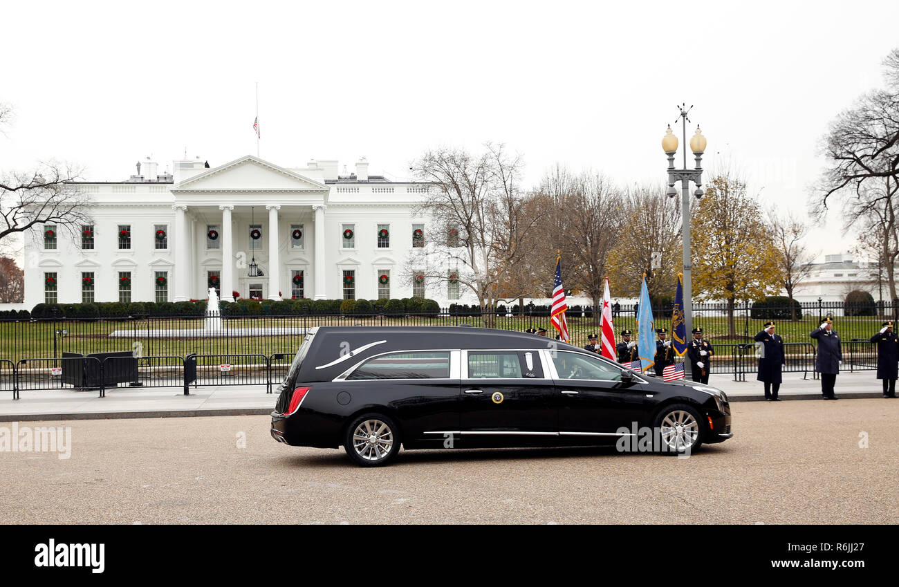 A hearse carrying the flag-draped casket of former U.S. President ...