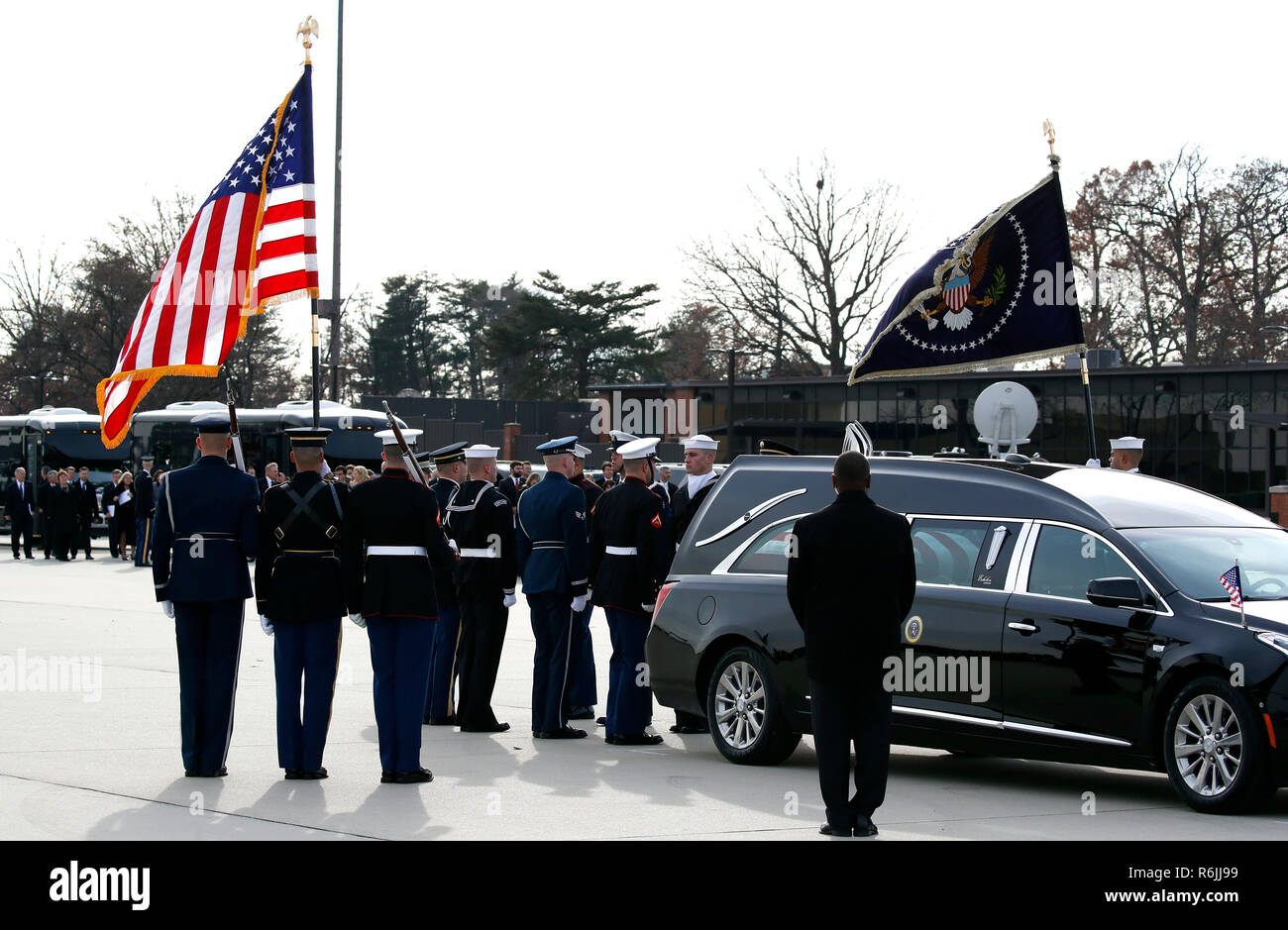 The flag-draped casket of former President George H.W. Bush is carried ...
