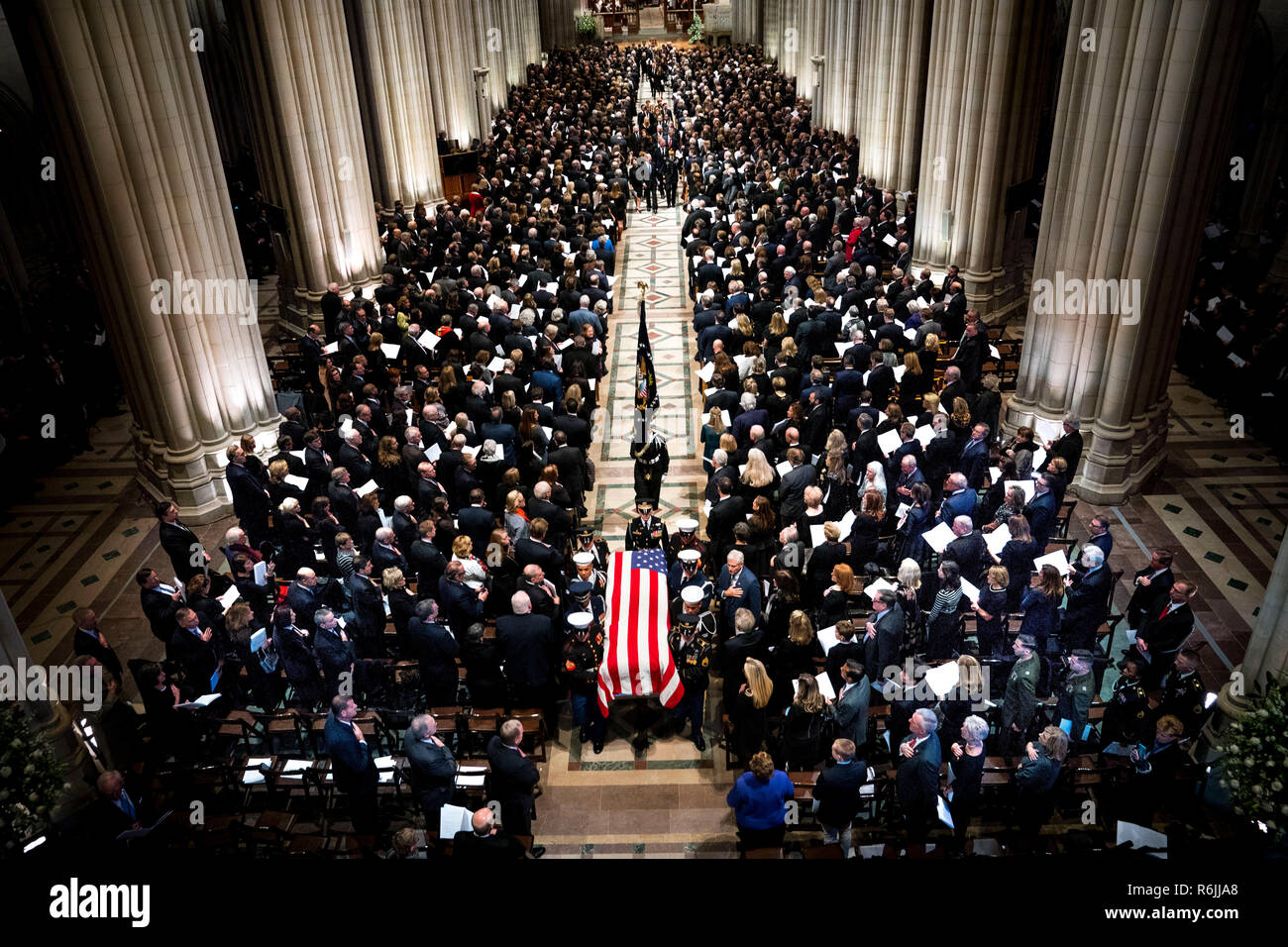 The Honor Guard carries the casket of former president George Herbert ...