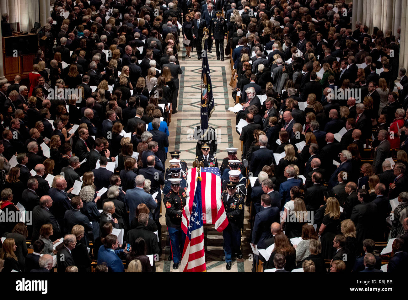 The flag-draped casket of former President George H.W. Bush is carried ...