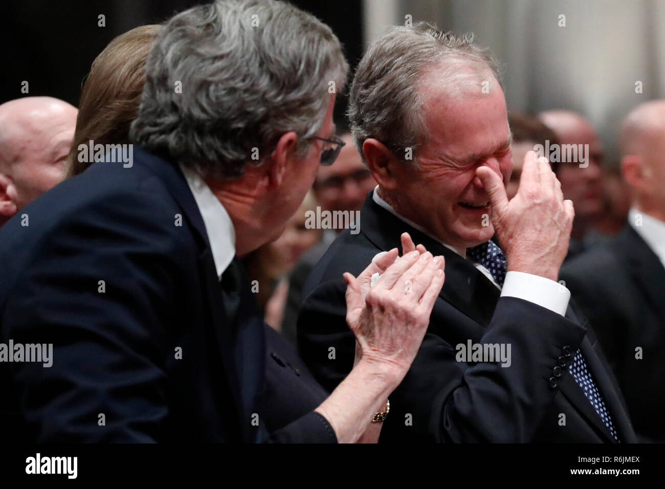 Former President George W. Bush with his brother Jeb Bush and Laura ...