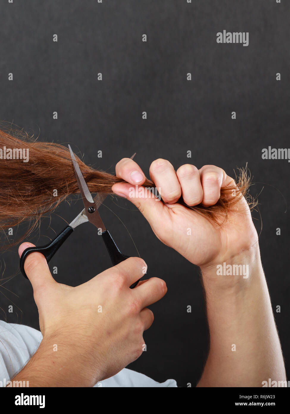 Change of look. Barber and hairdresser. Male hands with scissors ...