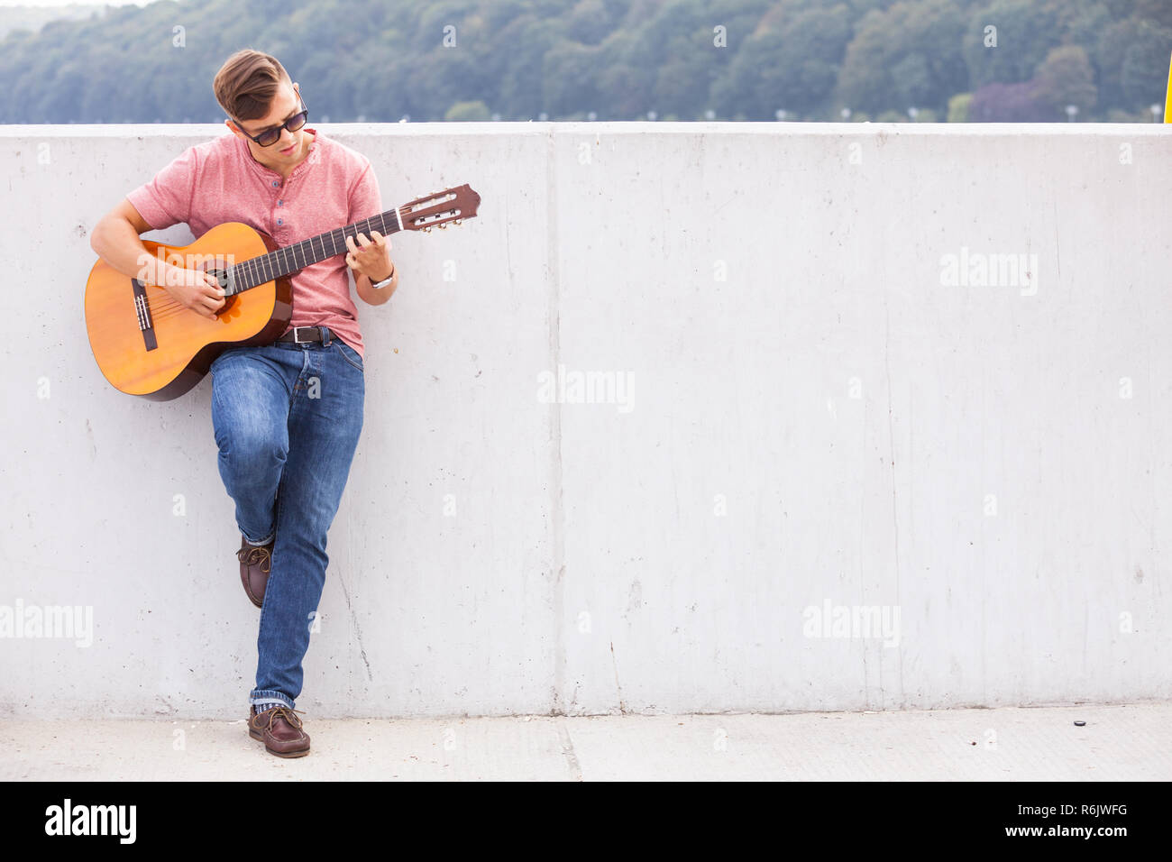 Guitar leaning on wall hi-res stock photography and images - Alamy