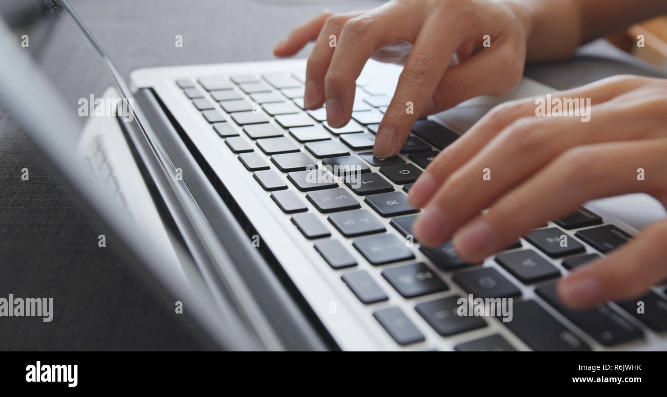Working on report with laptop computer Stock Photo - Alamy