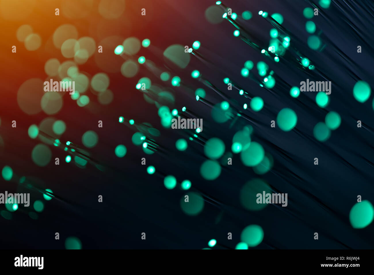 Fiber optics in green, close up with bokeh, warm lens flare Stock Photo ...