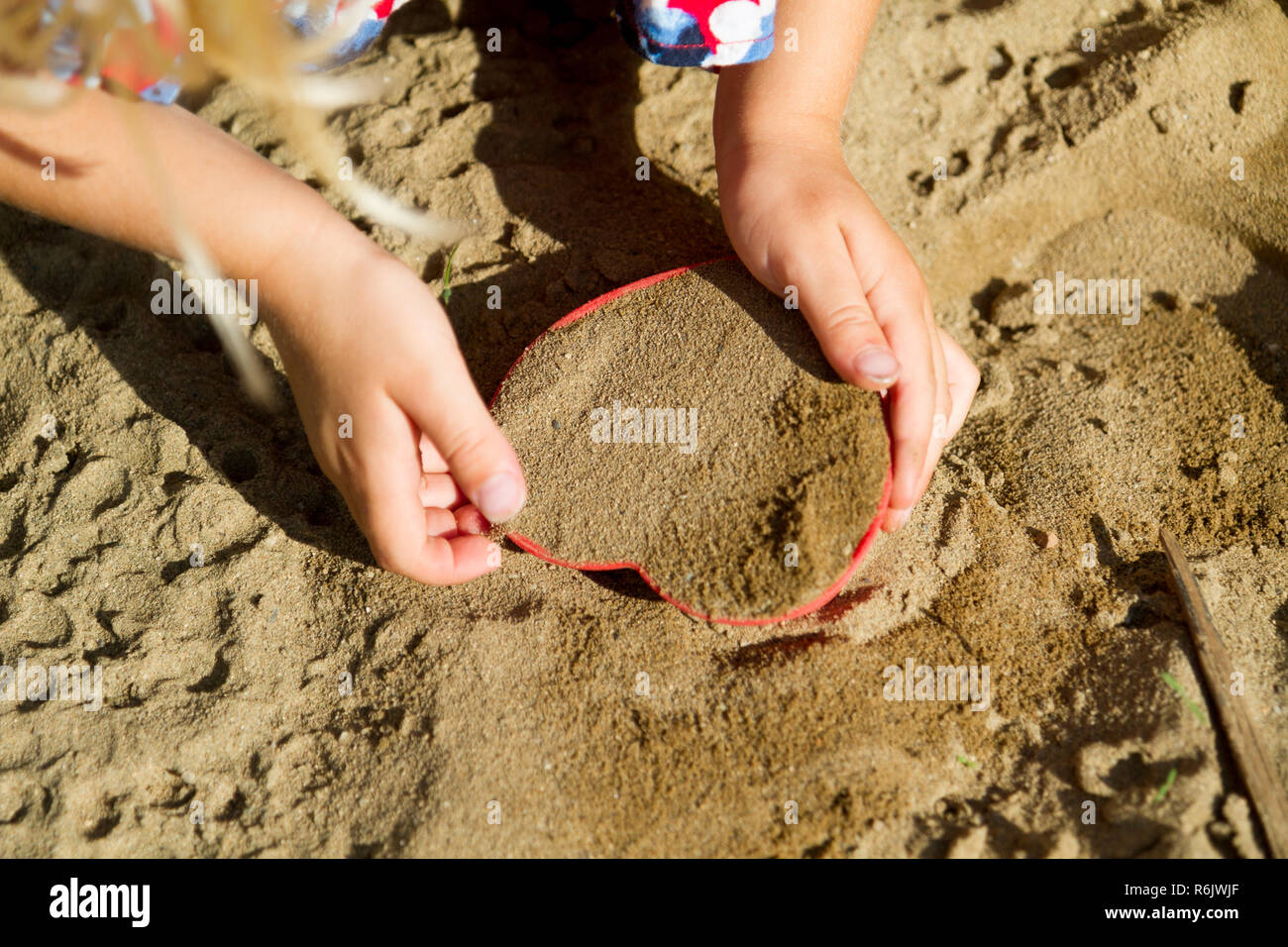 Child hand making heart hi-res stock photography and images - Alamy