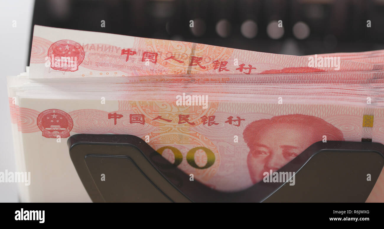 Counting money machine calculate the number of RMB Stock Photo - Alamy