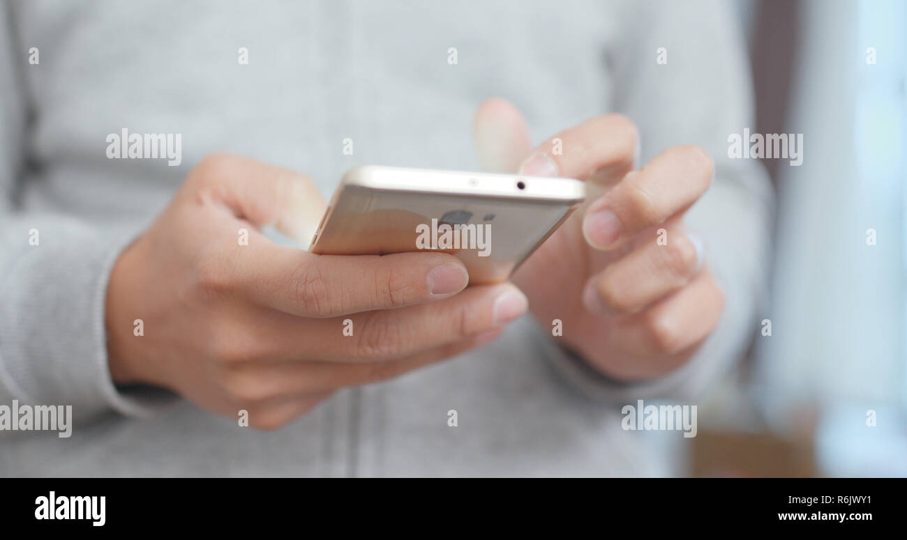 Body part of Man use of mobile phone Stock Photo - Alamy