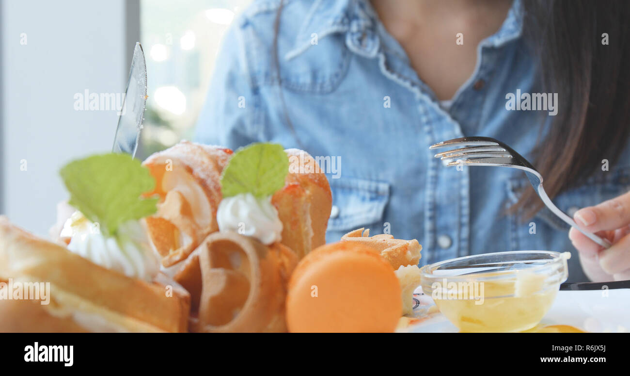 Woman eating chocolate wafer hi-res stock photography and images - Alamy