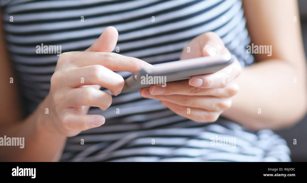 Body part of woman using cellphone Stock Photo - Alamy