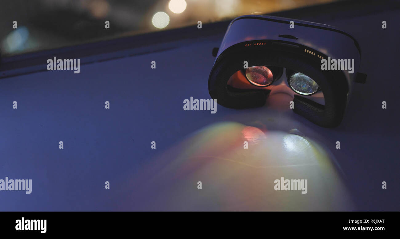 VR device playing video inside at night Stock Photo - Alamy