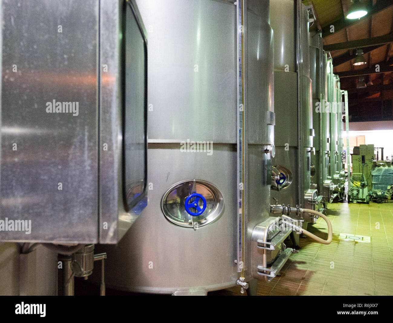 Cellar with an industrial wine production system Stock Photo - Alamy