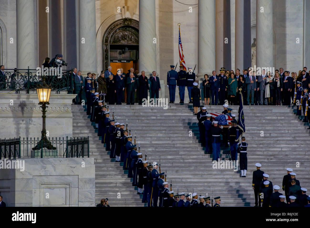 Joint Service pallbearers carry the flag-draped casket of former ...