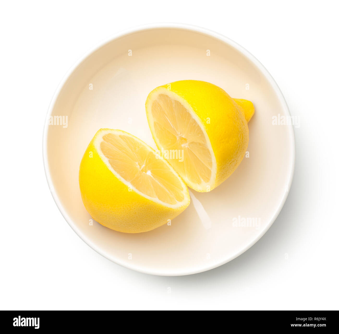 lemon in bowl isolated on white background Stock Photo - Alamy