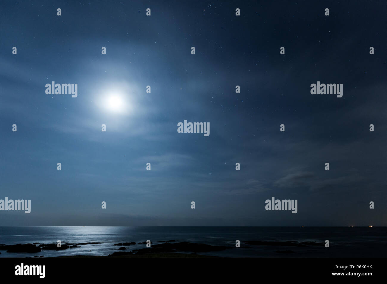 Moon and seascape at night Stock Photo - Alamy
