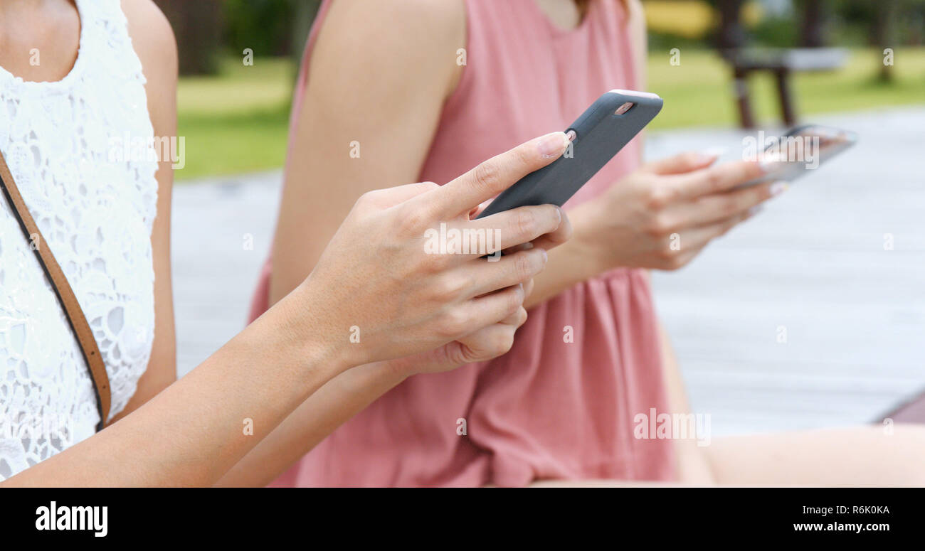 Using mobile phone at outdoor Stock Photo - Alamy