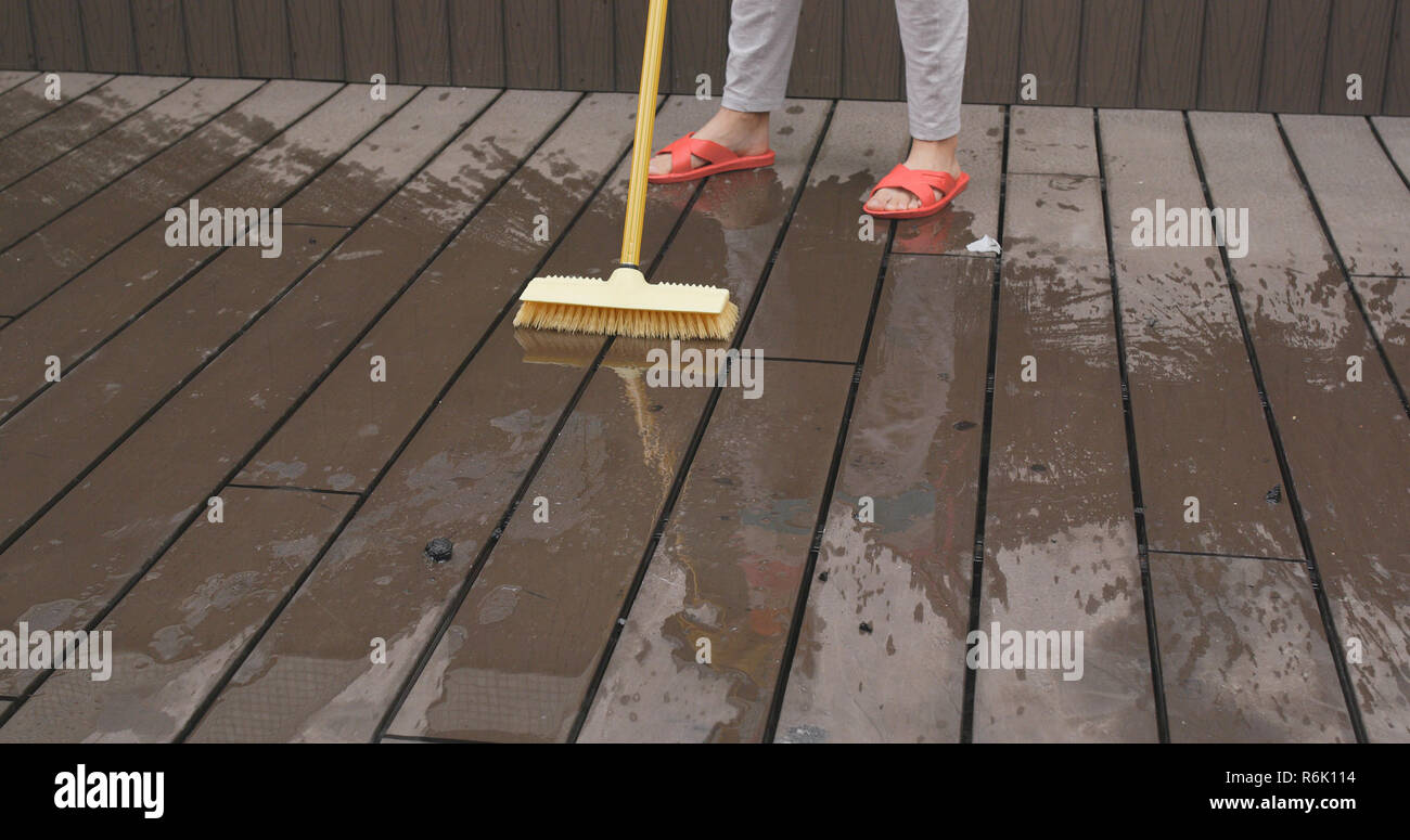 Cleaning the floor with brush Stock Photo - Alamy