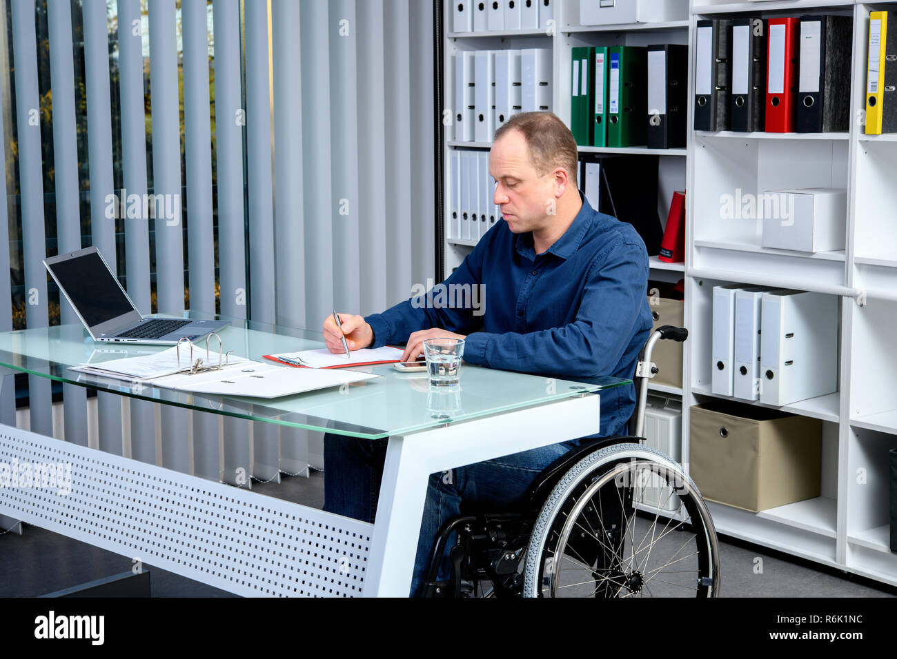 disabled business in wheelchair Stock Photo - Alamy